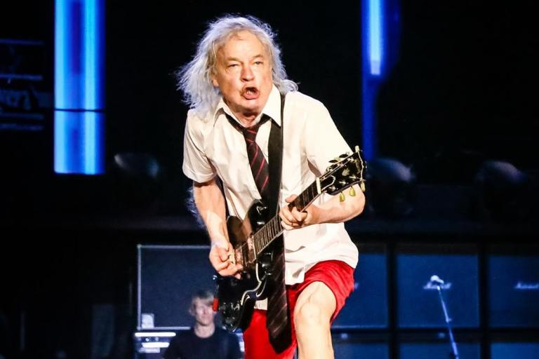The High Voltage Rocker: Angus Young and His Schoolboy Charm ...